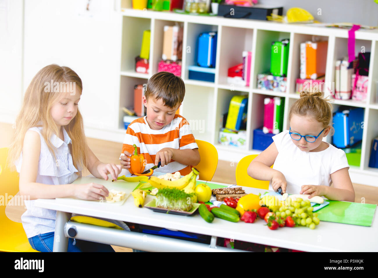 At school - Students prepare their healthy snack themselves Stock Photo ...