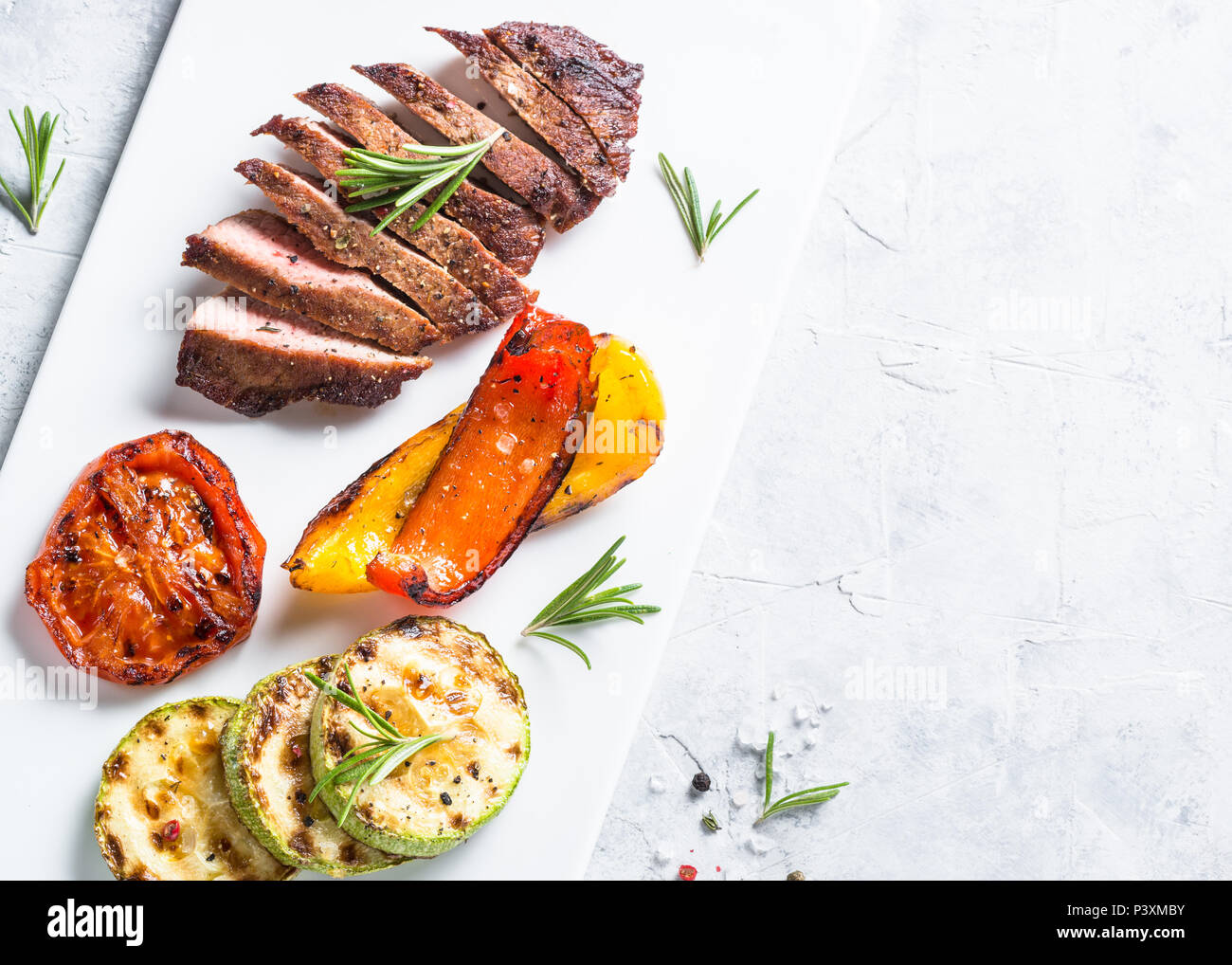 Barbecue dish. Beef steak and grilled vegetables. Top view with copy ...