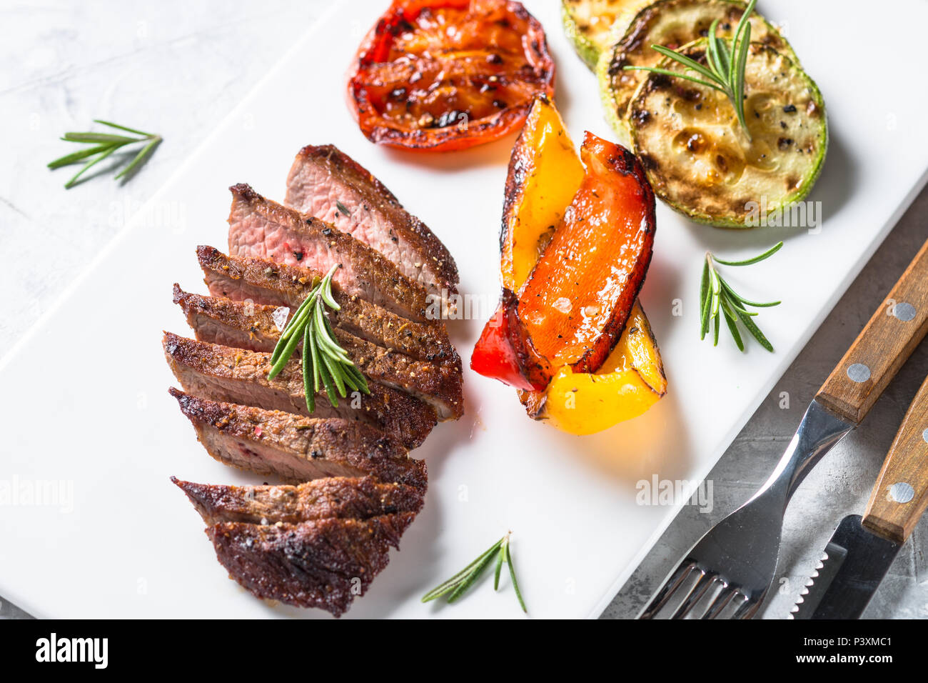 Barbecue dish. Beef steak and grilled vegetables. Top view with copy ...