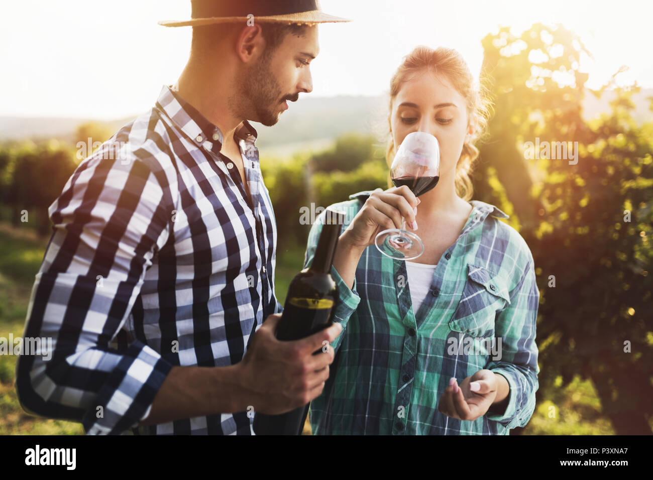 People tasting wine in vineyard Stock Photo - Alamy