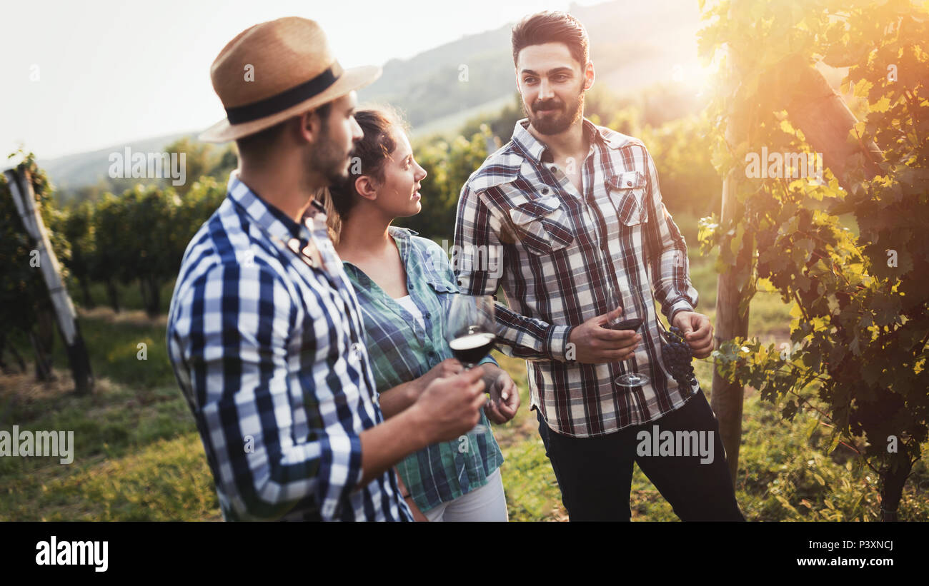 Wine grower and people in vineyard Stock Photo - Alamy