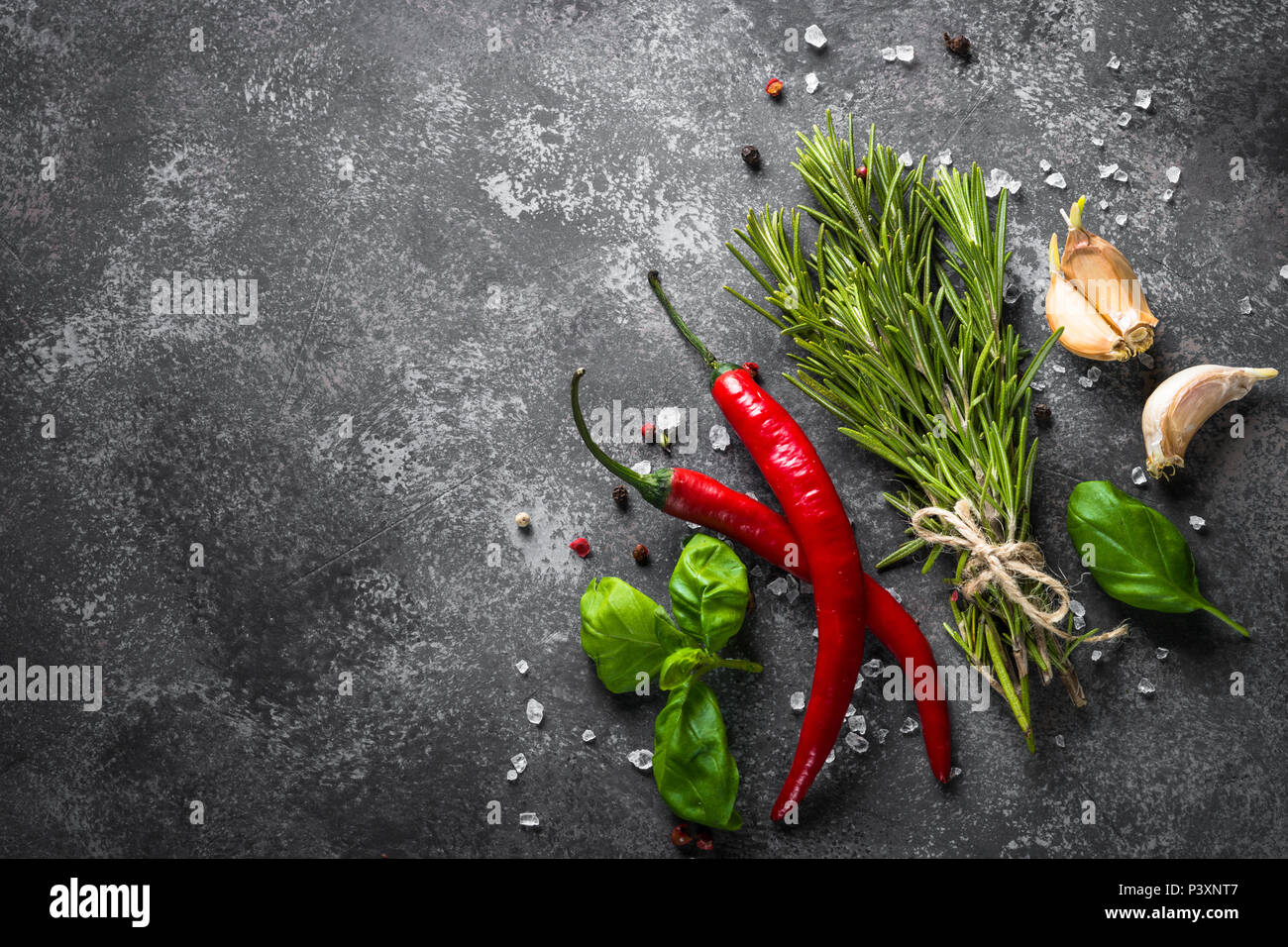 Spices and herbs over black stone table. Food background. Top view, Copy space Stock Photo - Alamy