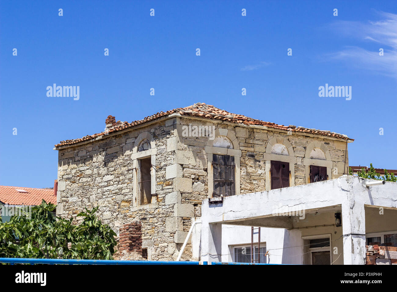 Perspective shot of old masonry building with close windows in Turkey ...