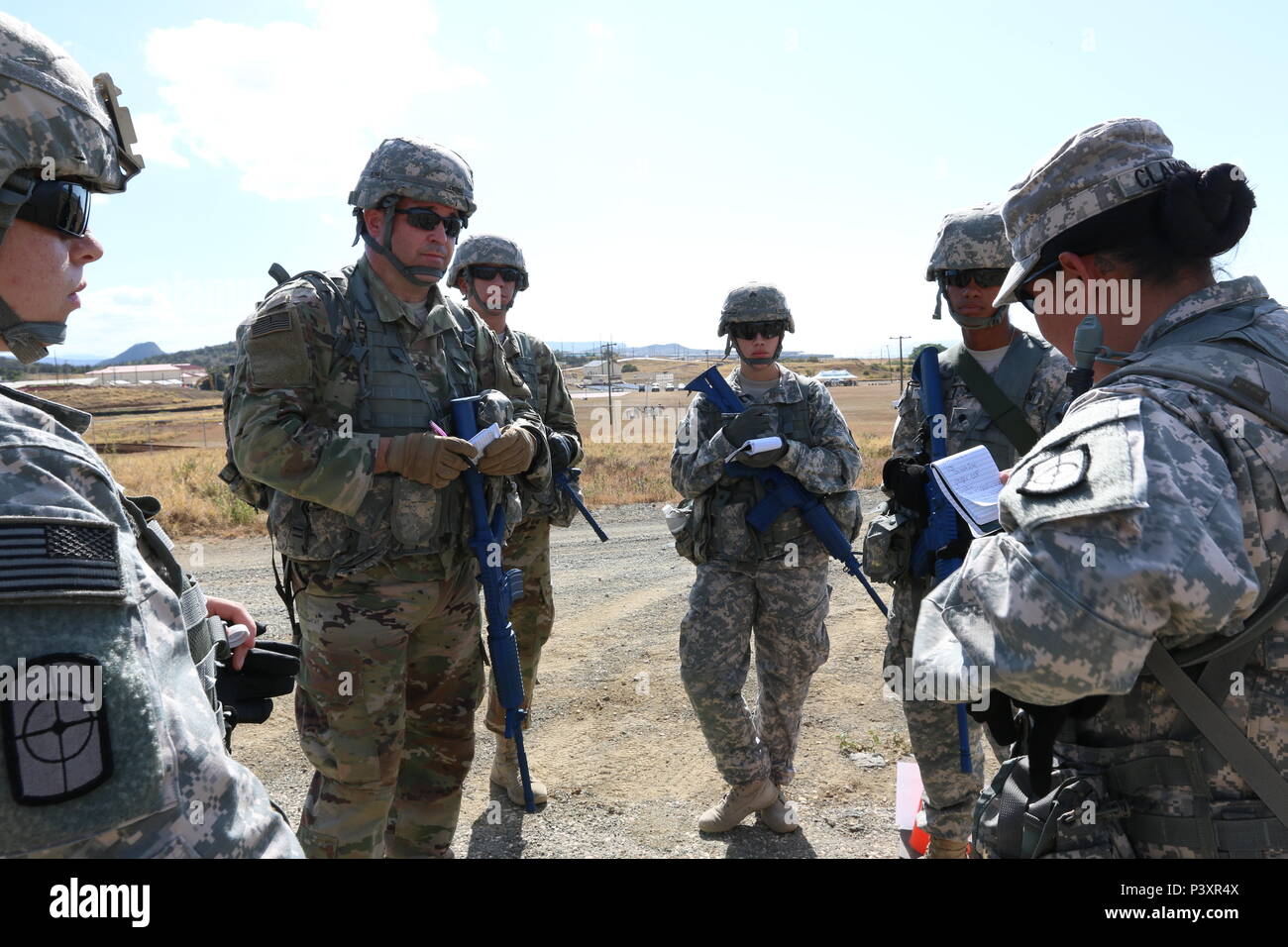 A 308th Military Police Company fire team leader explains the plan of ...