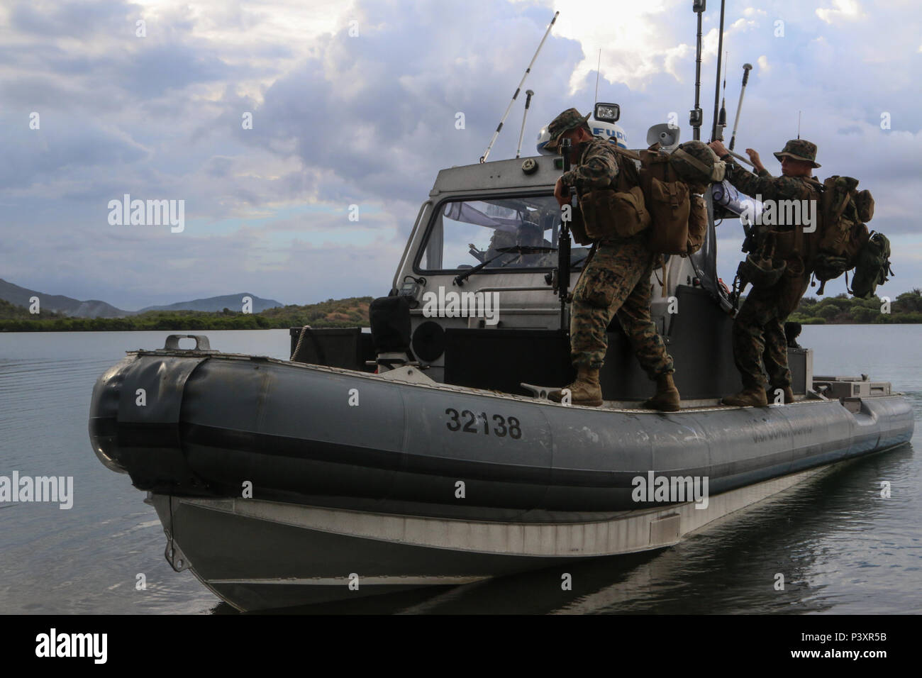 Two U.S. Marines prepare to dismount a Transportable Port Security Boat ...