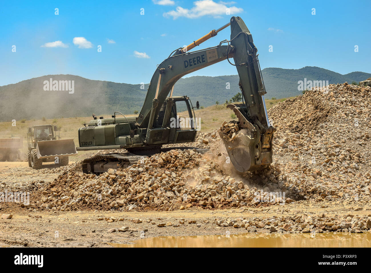 A hydraulic excavator operated by military engineers from the 841st ...