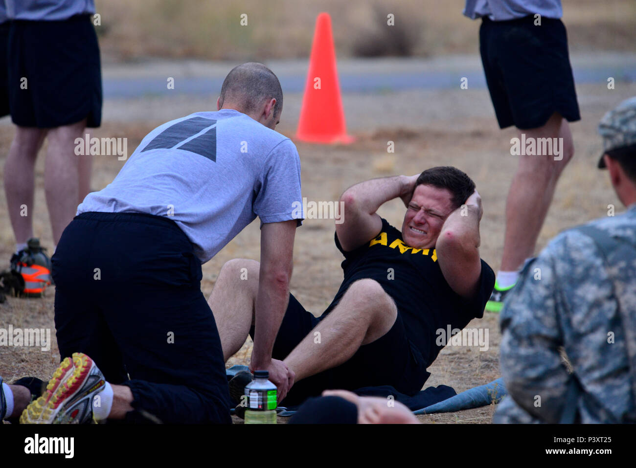 An Oregon Army National Guard Soldier Muscles Through The Sit Up Portion Of The Army Physical