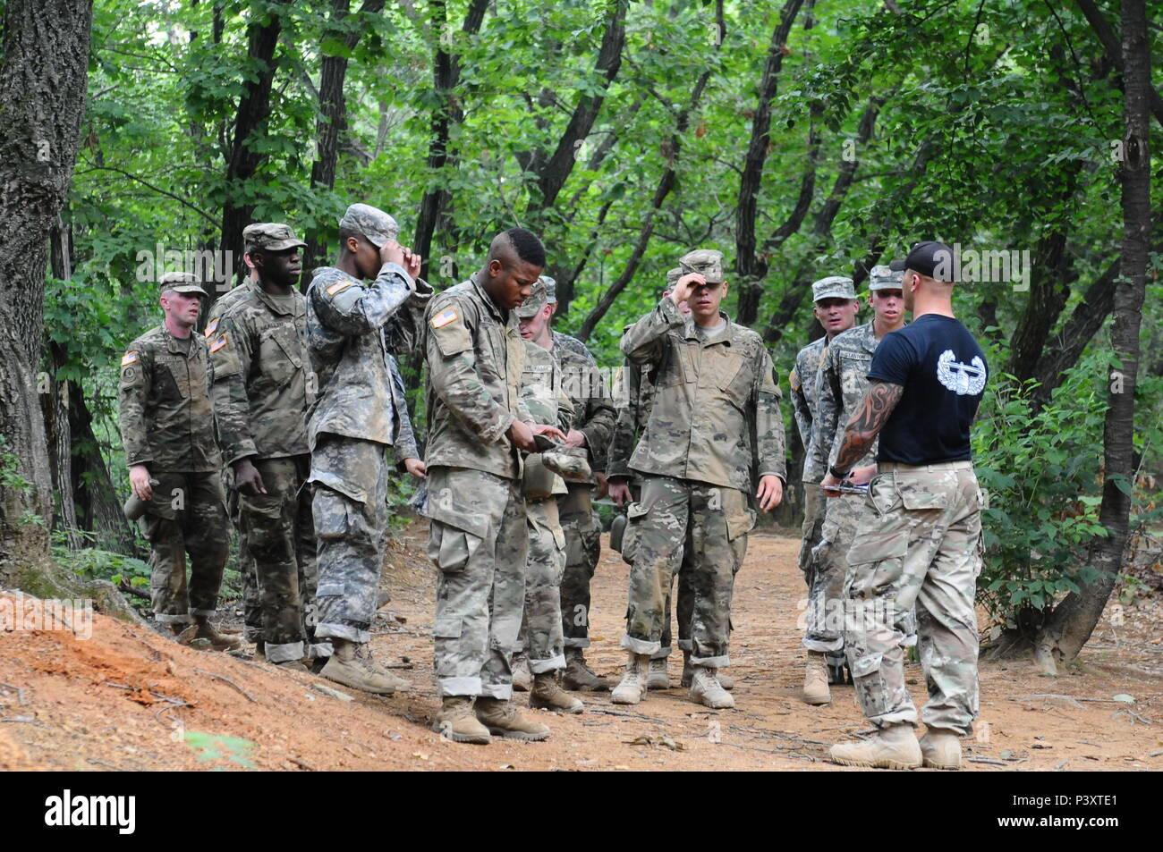 Soldiers attending the Air Assault course receive instructions after ...