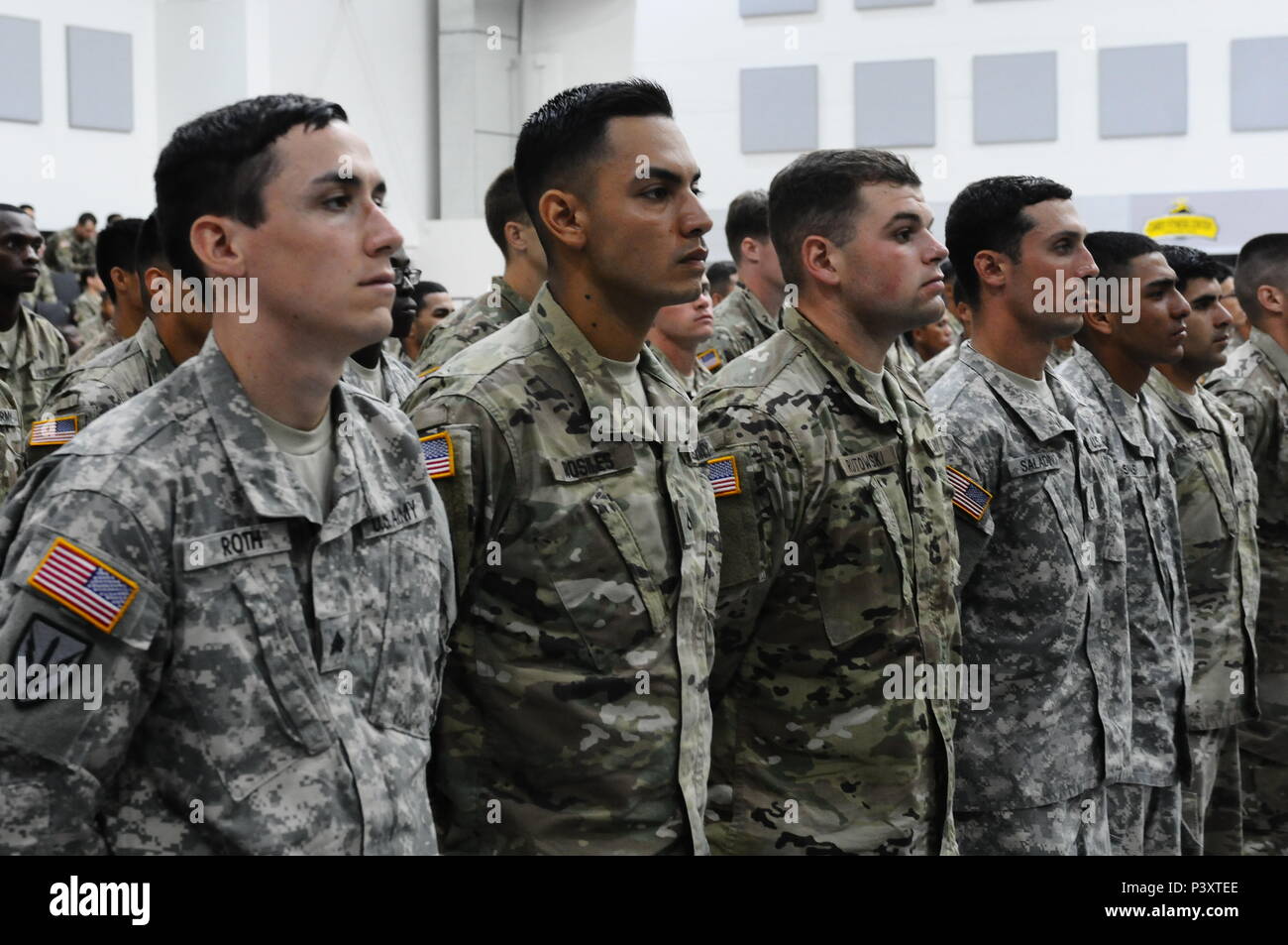 Soldiers graduating from the Air Assault course stand in a formation ...
