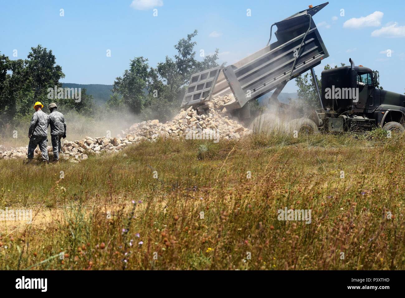 A 20-ton dump truck operated by military engineers from the 841st ...