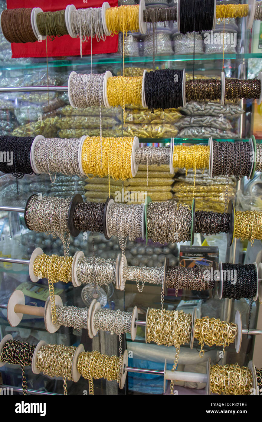 Rolls of decorative chains in view Stock Photo - Alamy