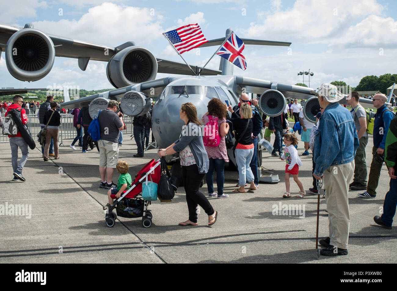 Attendees of the Yeovilton, England crowd around the 315th Airift Wing ...