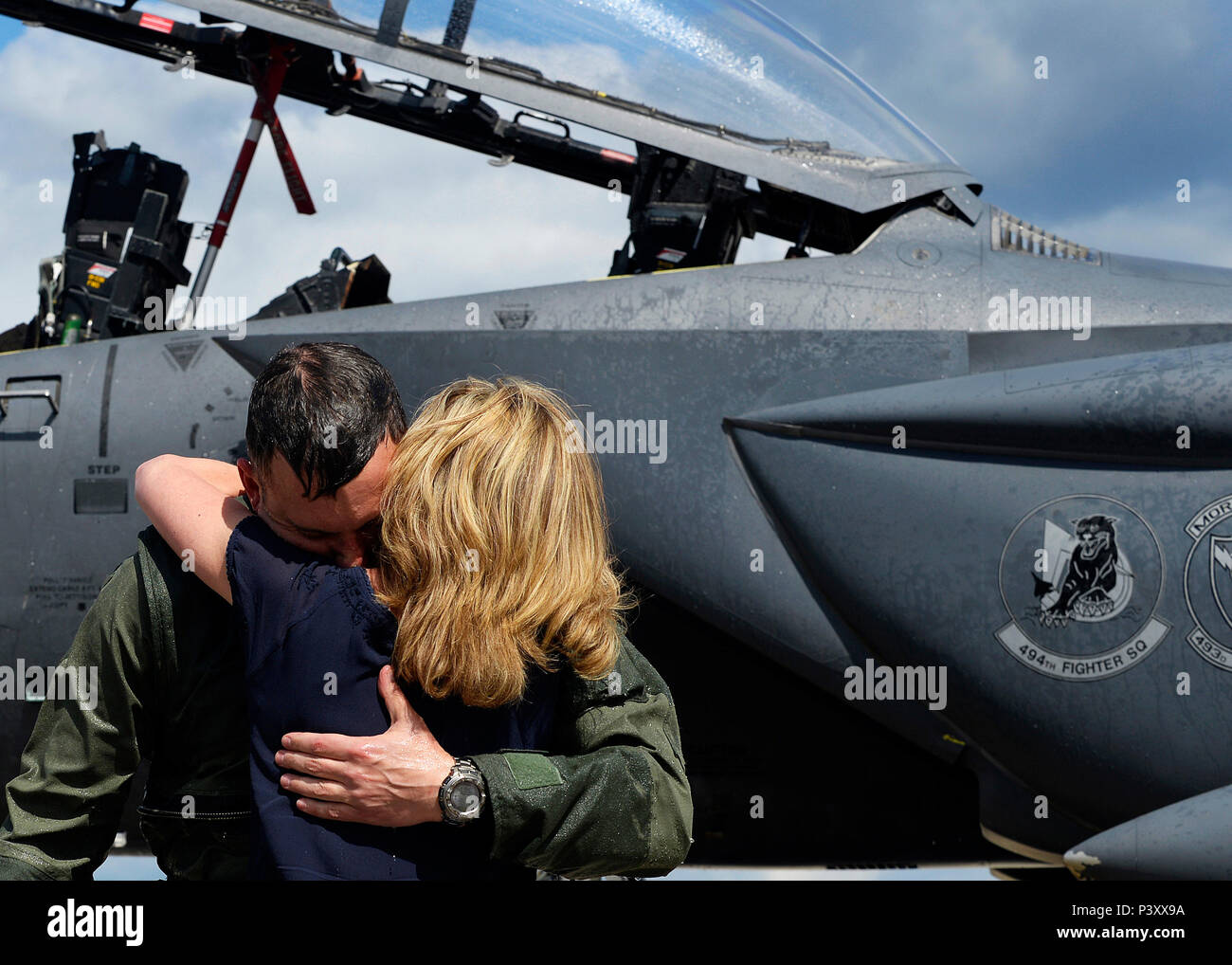 Col. Robert Novotny, 48 Fighter Wing commander, hugs his wife after completing his final flight ...