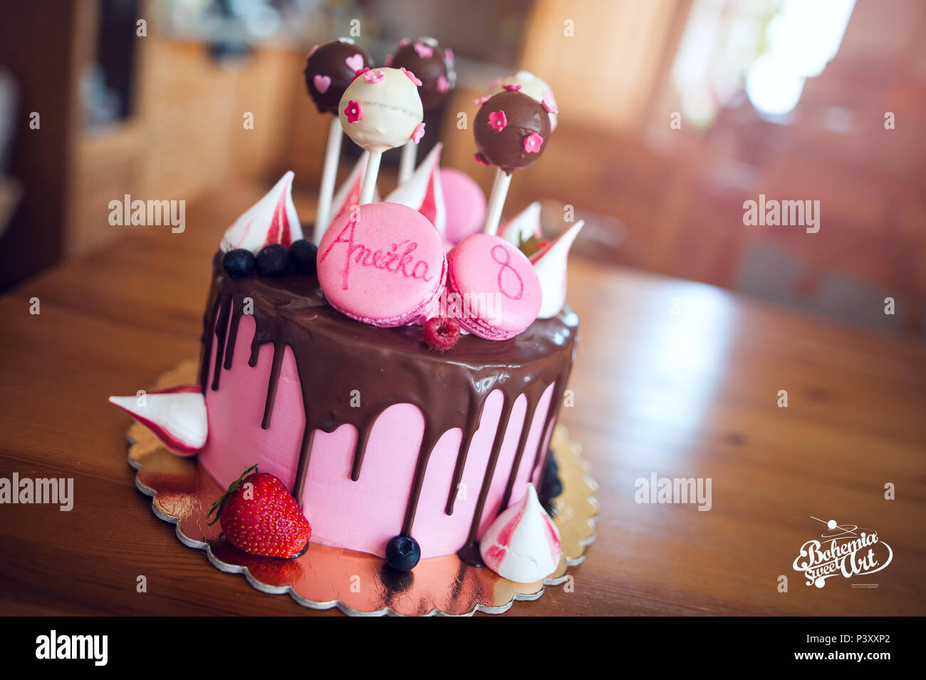 trendy drip cake with chocolate top and sweet decorations Stock Photo ...