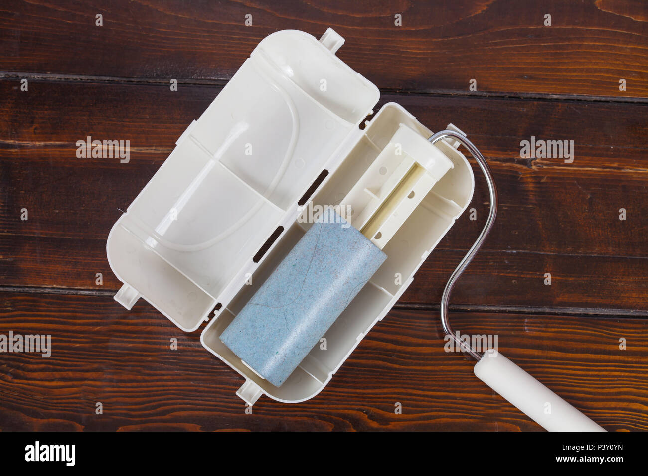 lint roller adhesive tape on wood table Stock Photo - Alamy