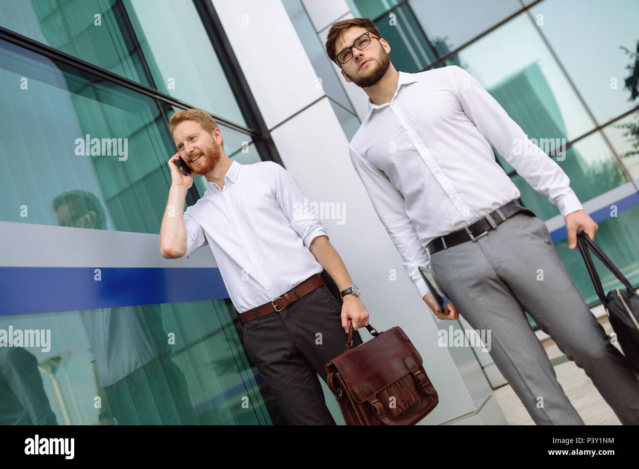 Business people talking outdoors Stock Photo - Alamy