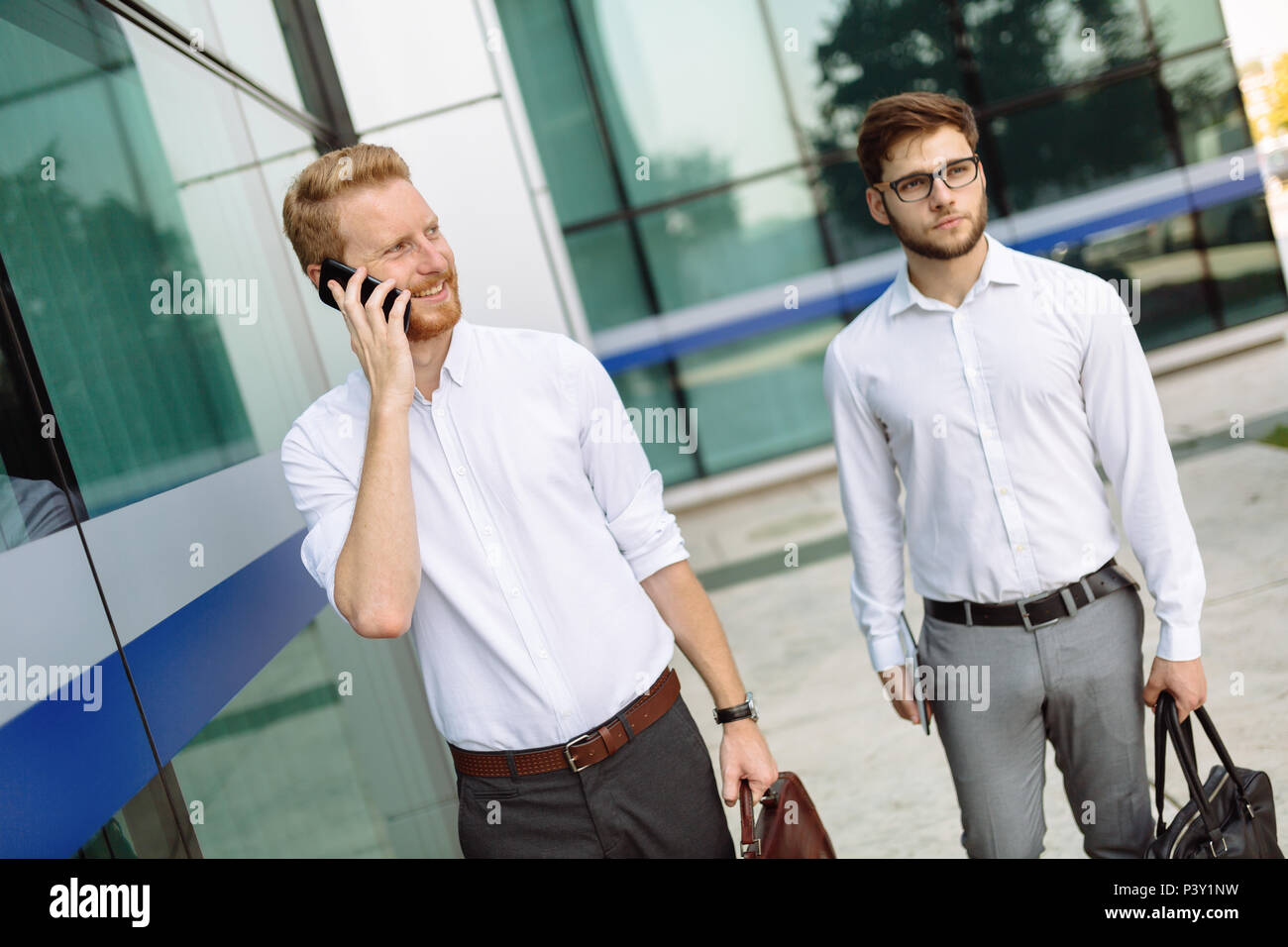 Business people walking outdoors Stock Photo - Alamy