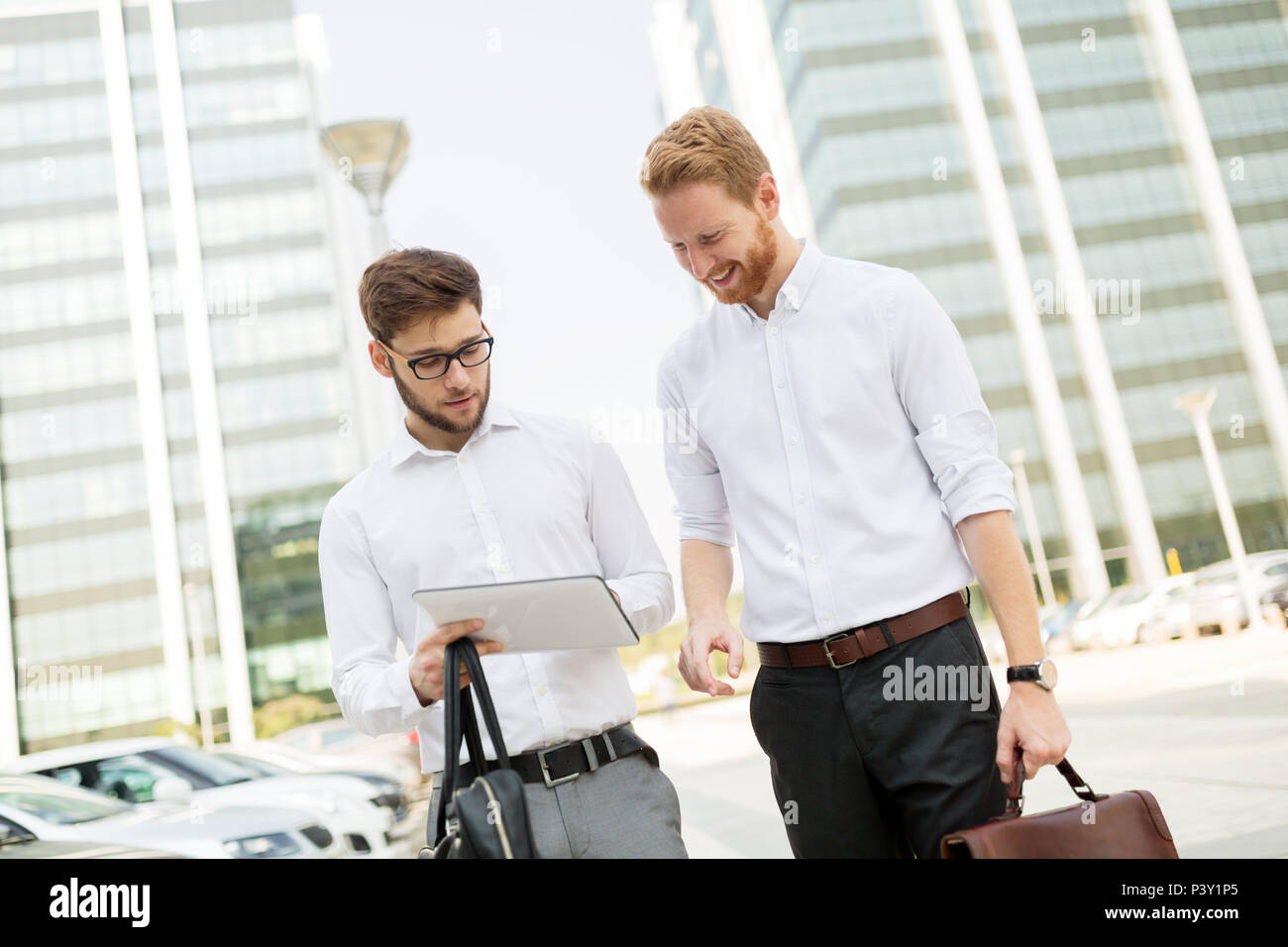 Business people talking outdoors Stock Photo - Alamy