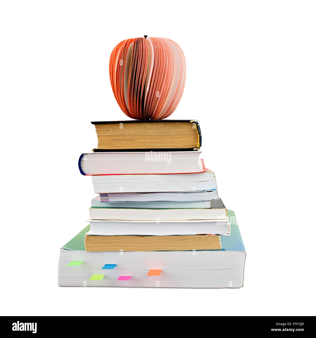 Pile of old text books with fake paper apple isolated on white ...
