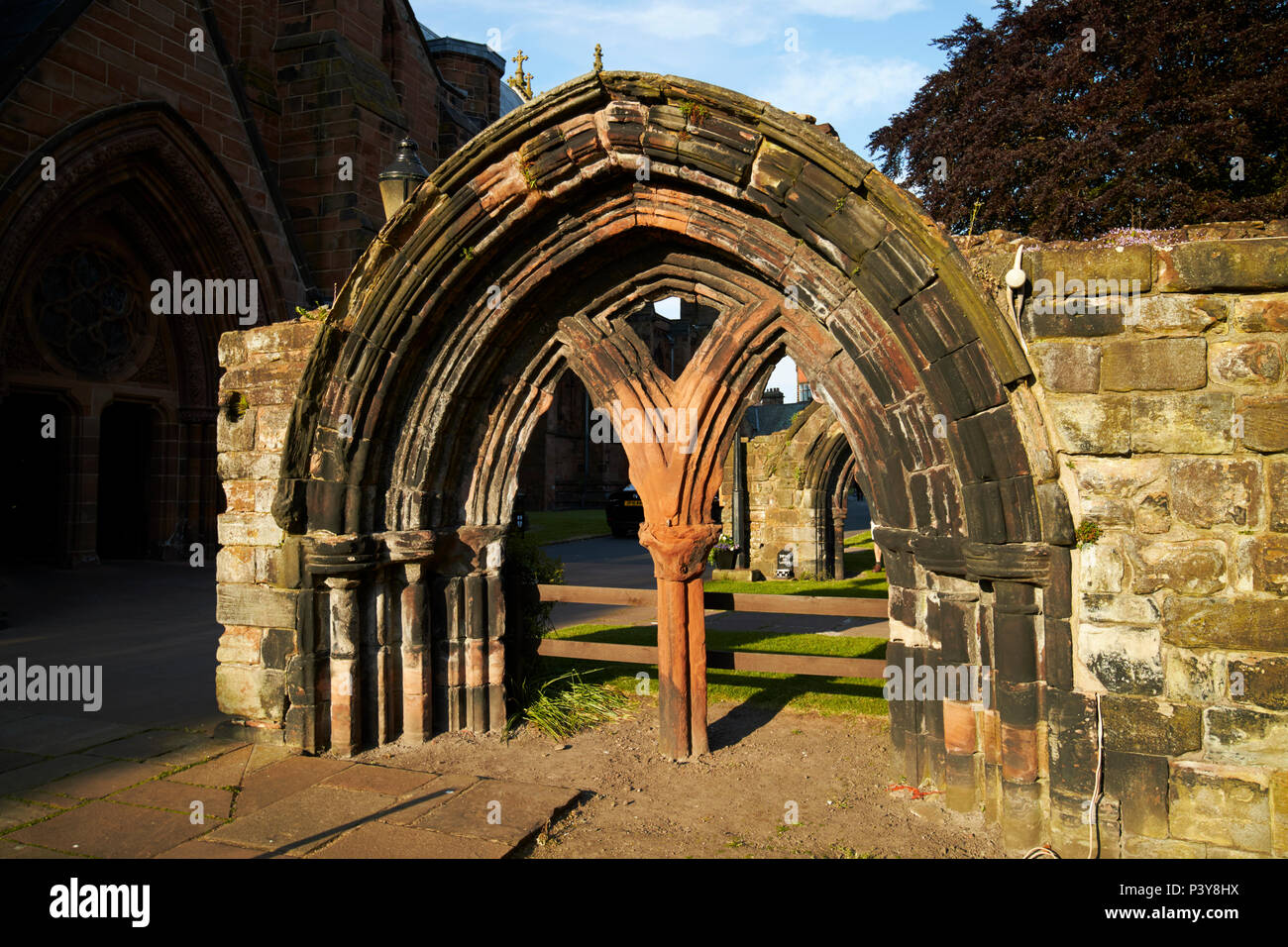 old ornate arched window part of the previous priory in the grounds of ...