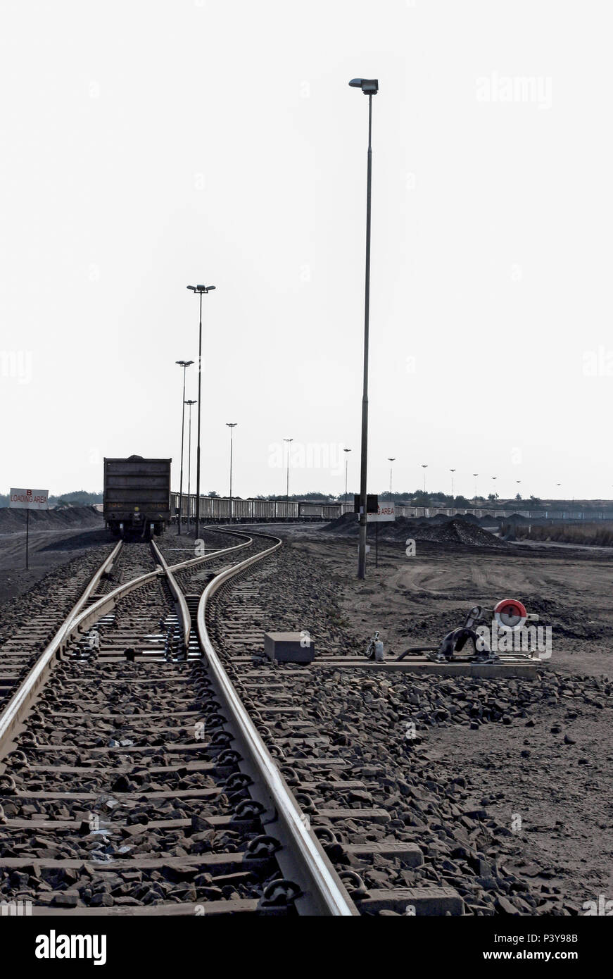 Piles of processed coal next to a rail siding waiting to be put on a ...