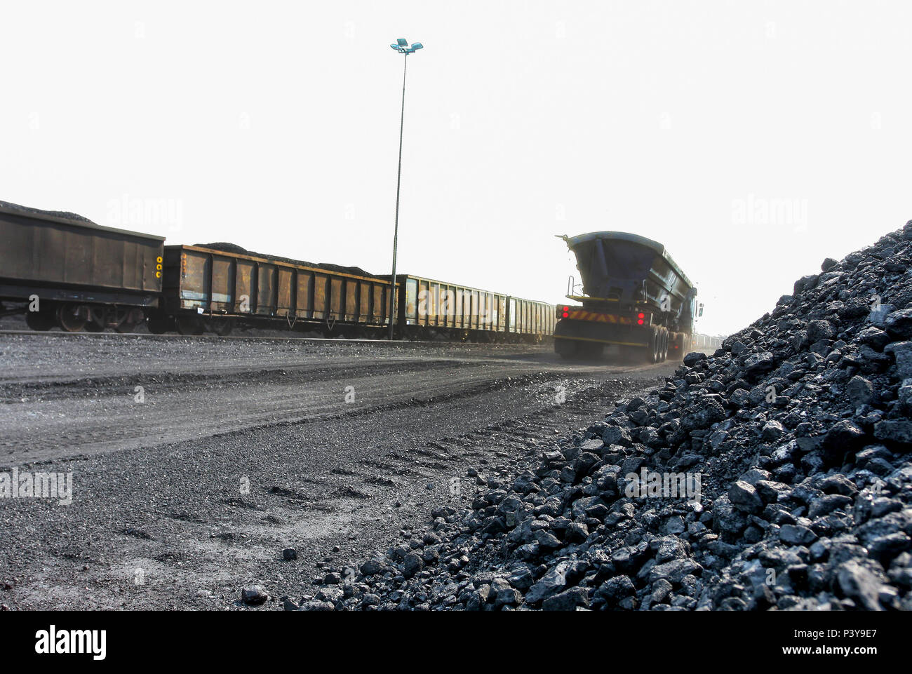 Piles of processed coal next to a rail siding waiting to be put on a ...