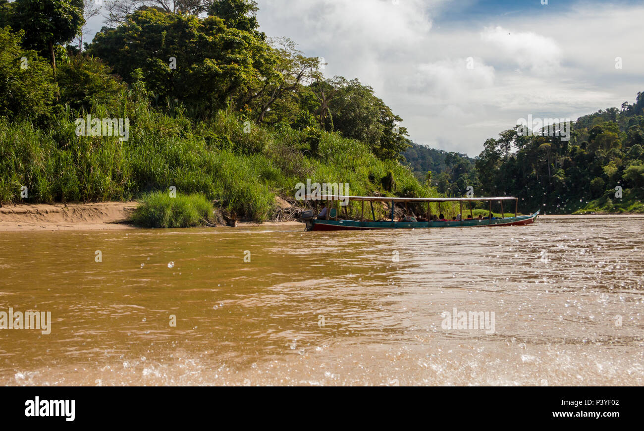A typical south-east Asian motorized long-tail boat transporting ...