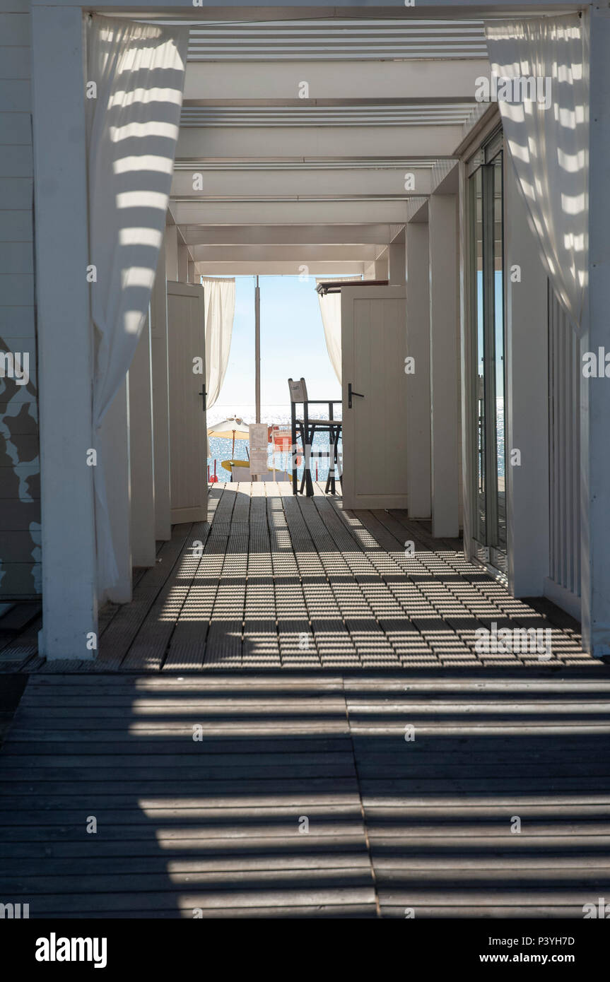 Summer light through a shaded holiday cafe at the beach Stock Photo - Alamy