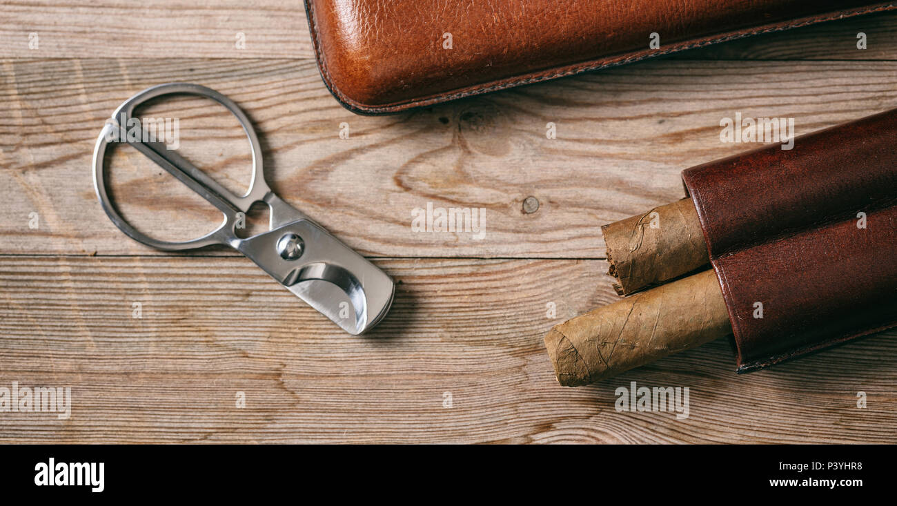 Cuban cigars in a leather case on wooden background, top view Stock ...