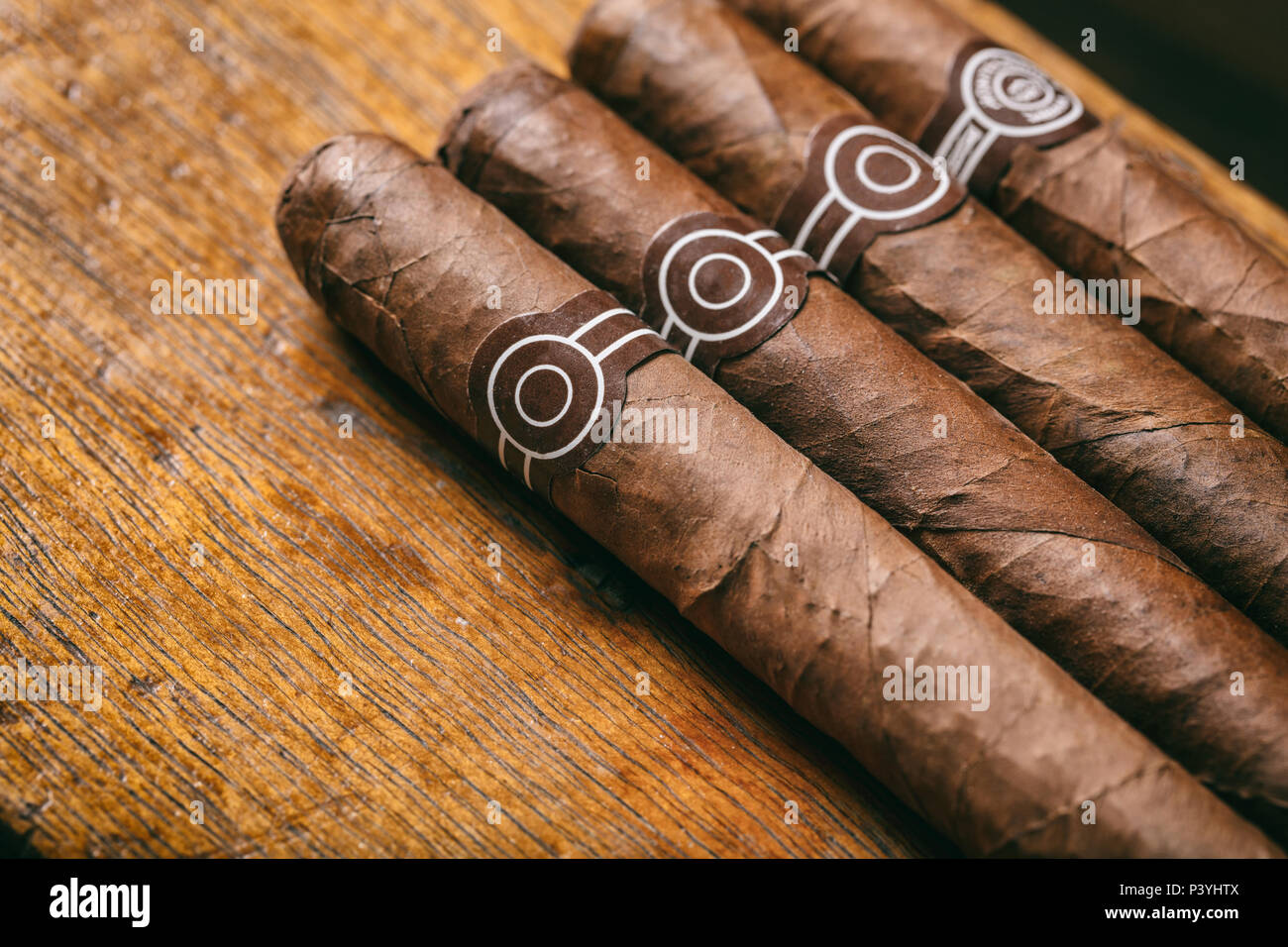 Cuban cigars on wooden background, copy space, top view Stock Photo - Alamy