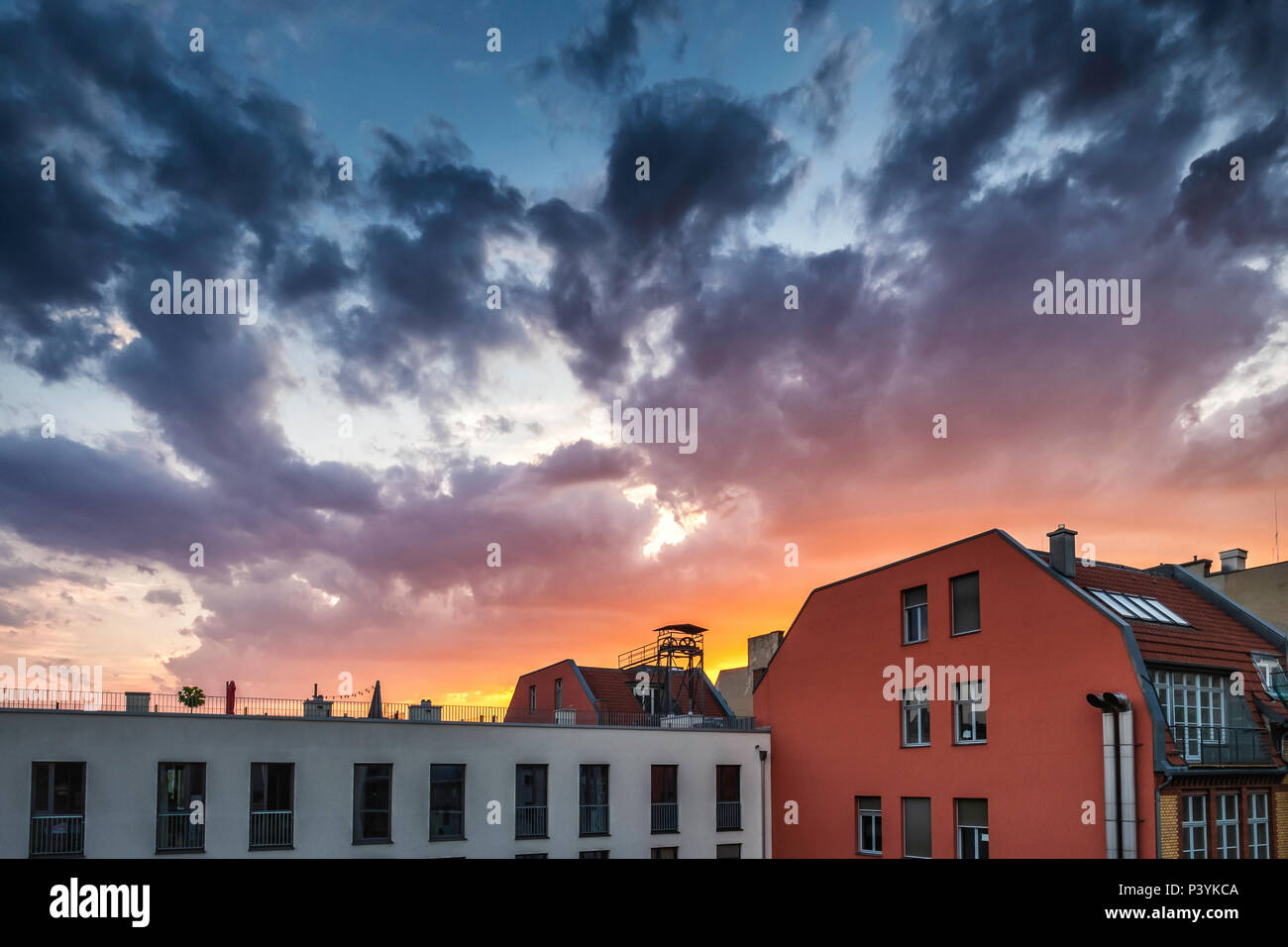 Berlin Sunset, Clouds and golden light over a Berlin Apartment building ...