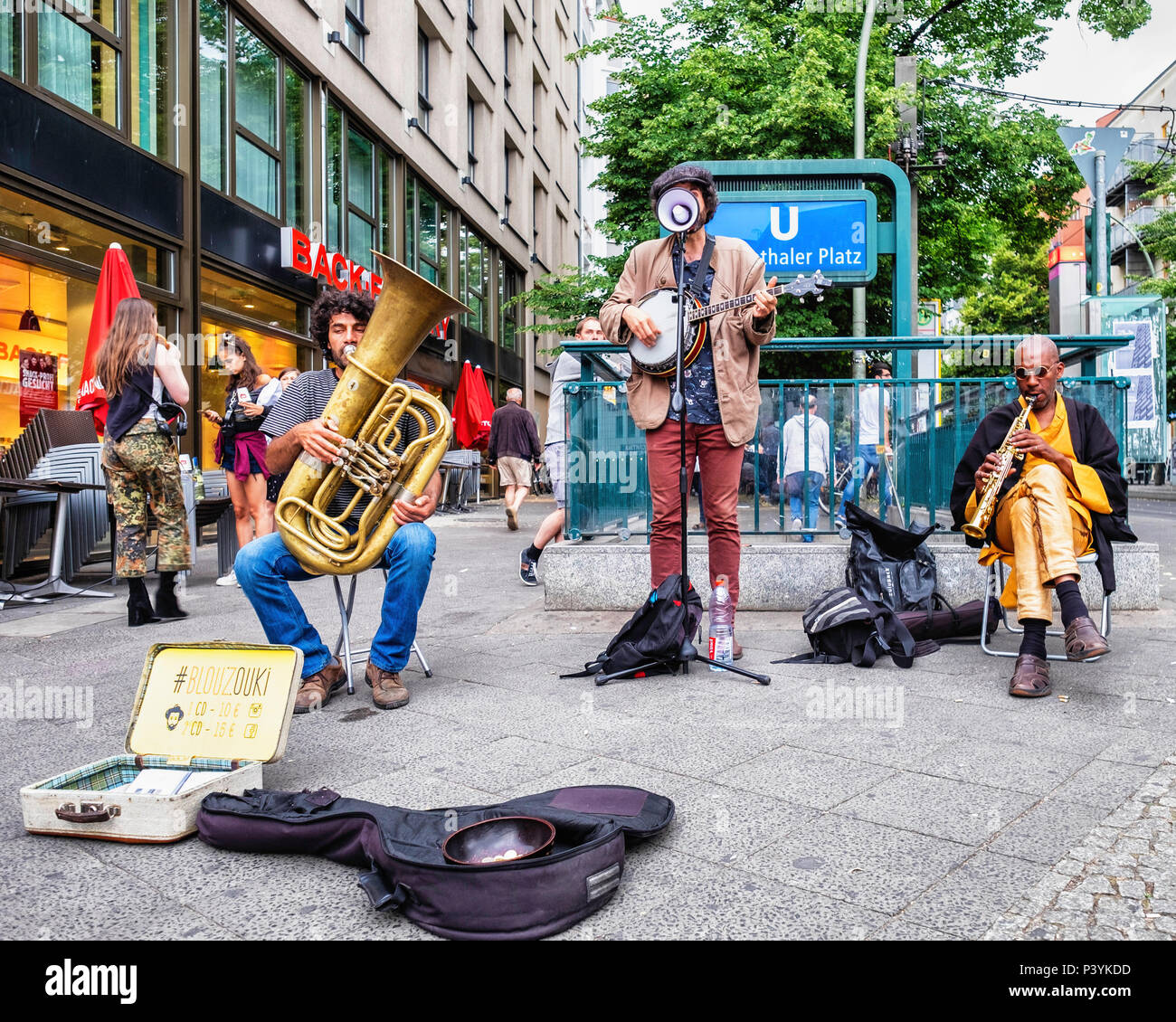 Three playing musical instruments hi-res stock photography and images ...