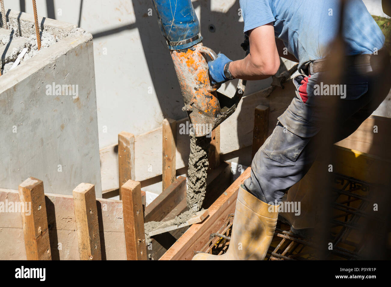 Pouring concrete on construction site Stock Photo - Alamy