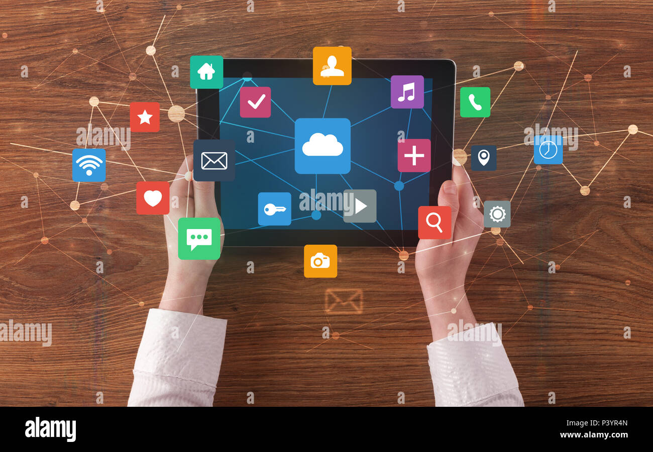 Hand touching multitask tablet with cloud wifi message social media ...