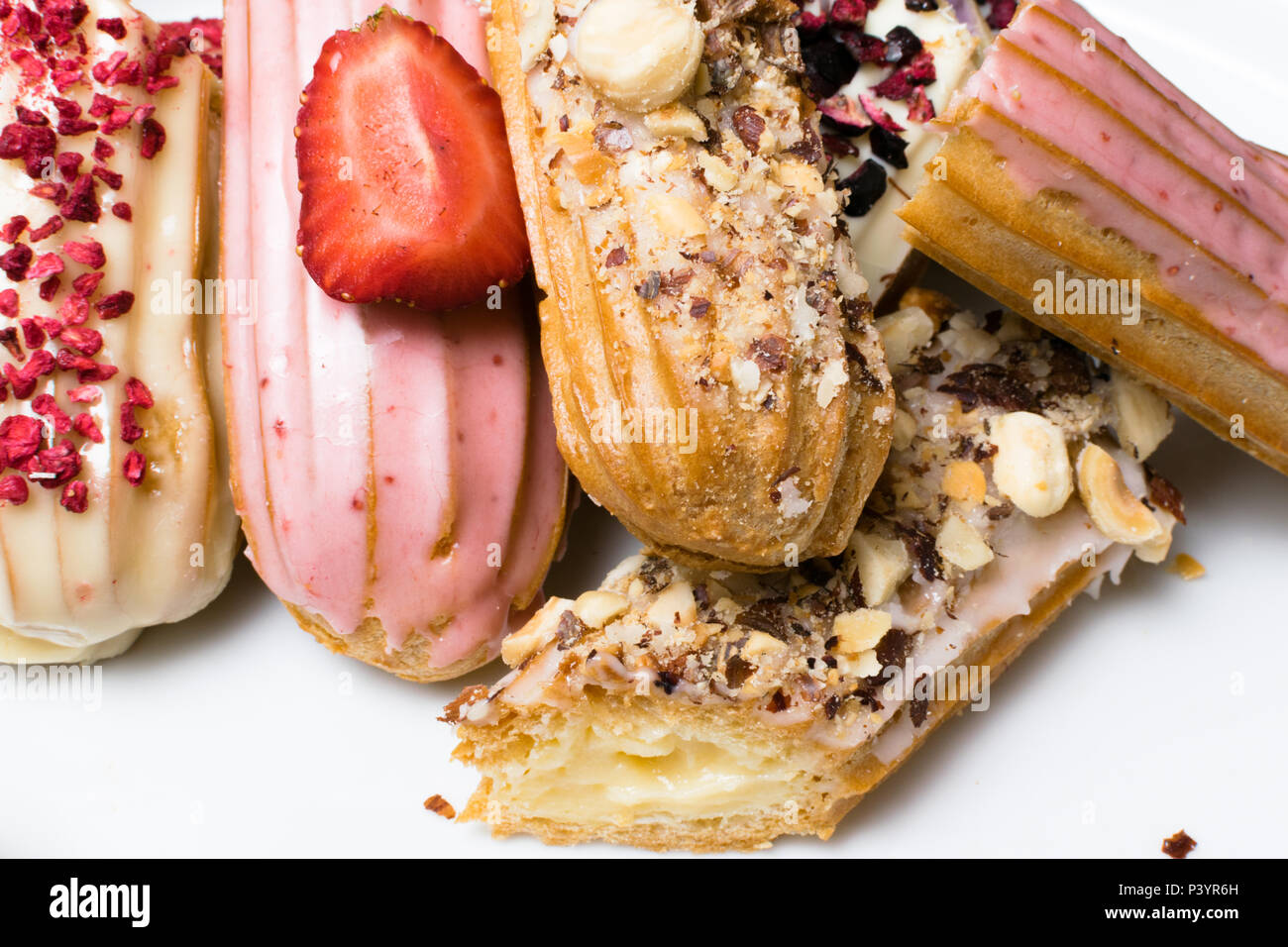 Sweet delicious colorful french eclairs. Group of french dessert ...