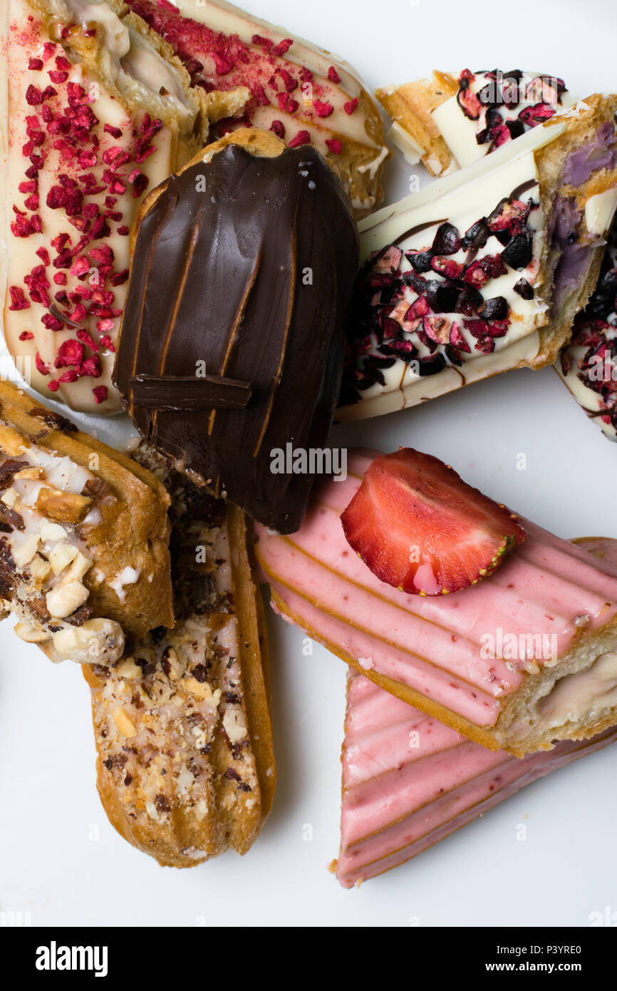 Sweet delicious colorful french eclairs. Group of french dessert ...