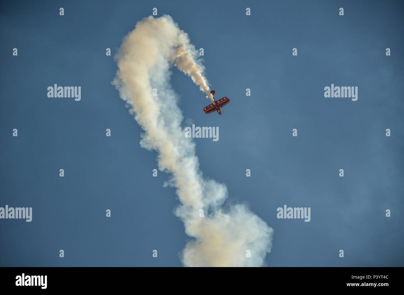 A stunt plane performance at an air show Stock Photo - Alamy