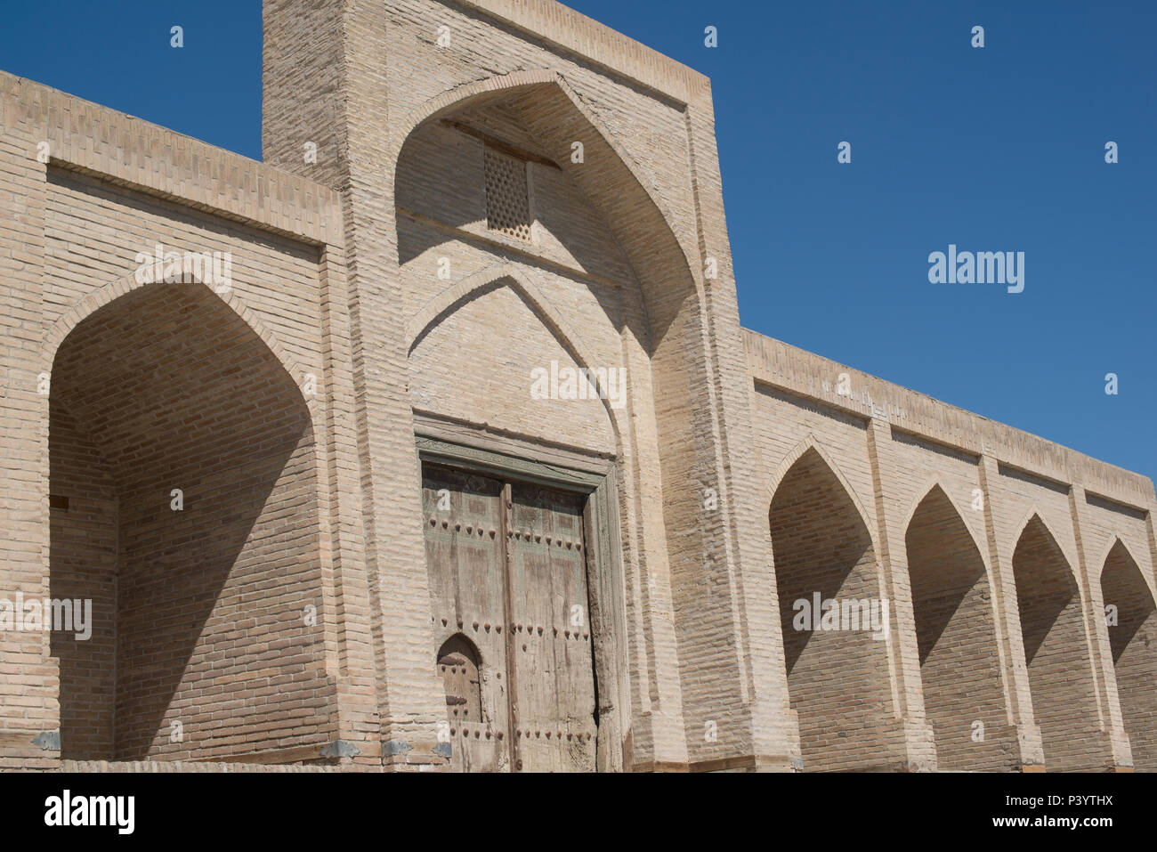 The old building, the wall with arches. Ancient buildings of medieval ...