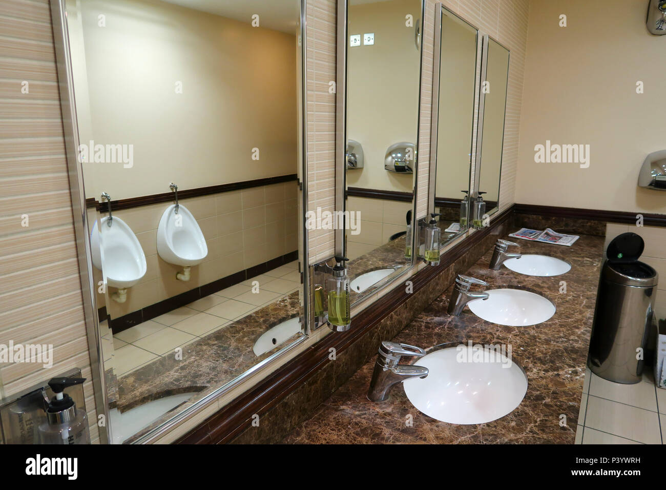 Vanity unit with inset sinks in public toilet Stock Photo - Alamy