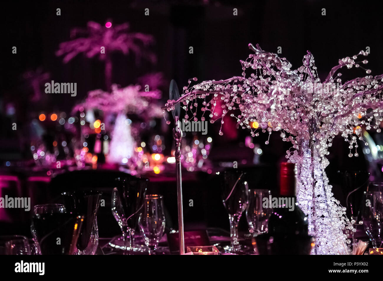Pink and Purple Decor with candles and lamps for corporate event or ...