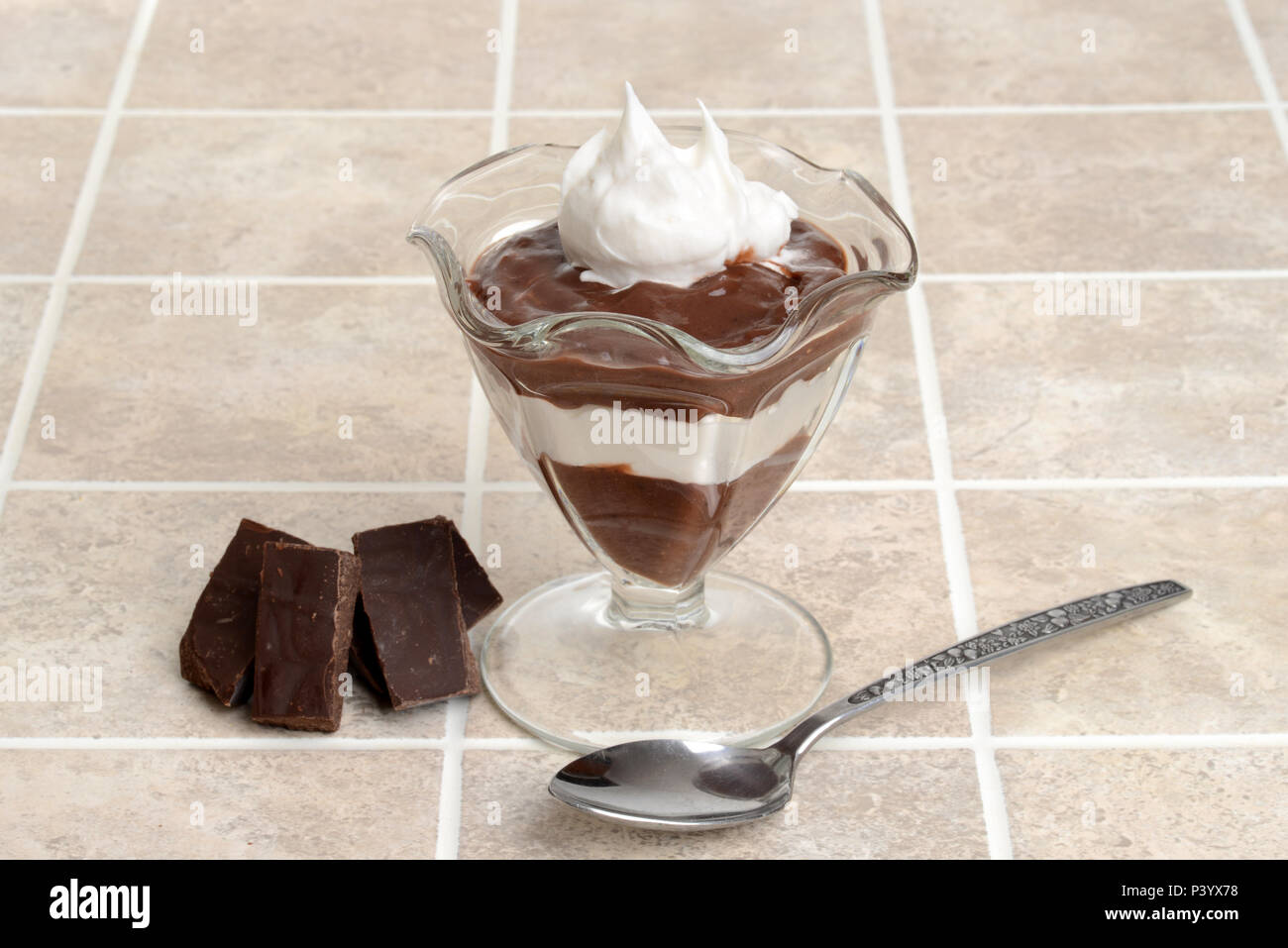 chocolate pudding with whipped cream and a spoon Stock Photo - Alamy