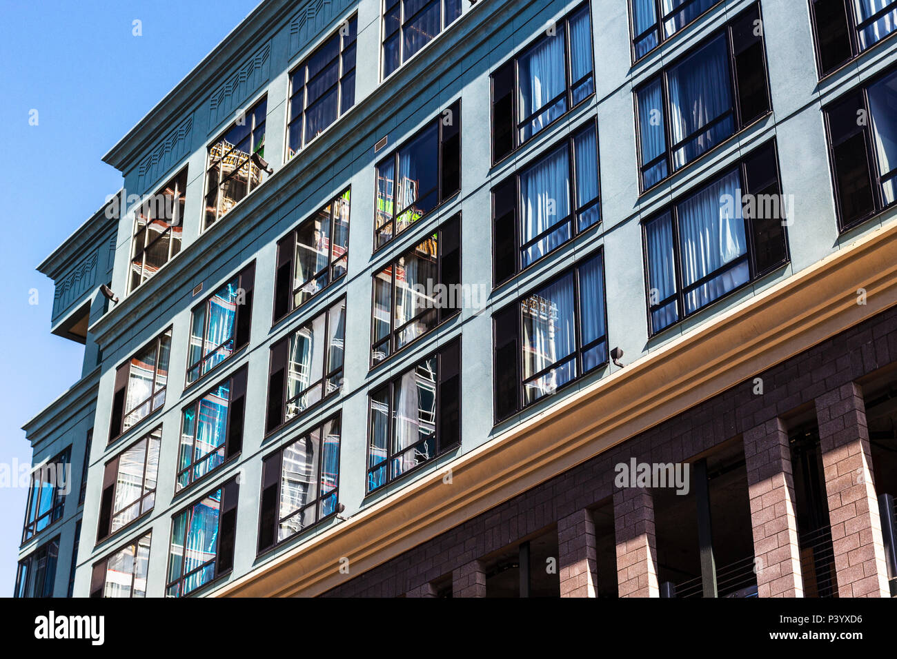 The BB&T building under construction is reflected in the windows of the ...
