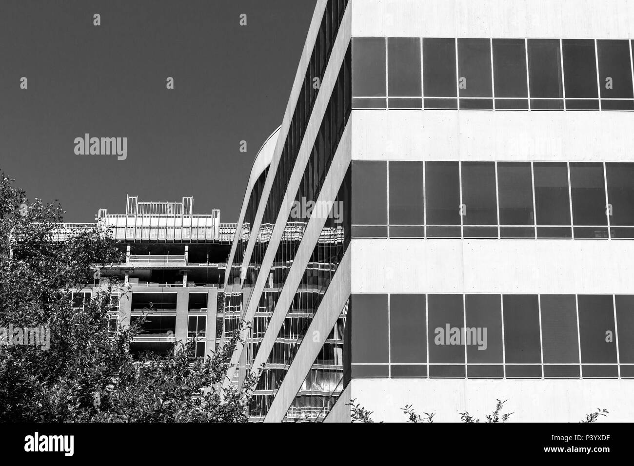 The BB&T building under construction is reflected in the mirror-like ...