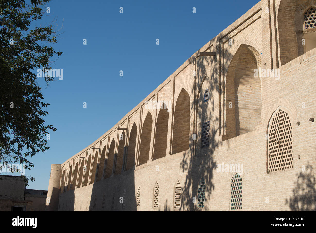 The old building, the wall with arches. Ancient buildings of medieval ...
