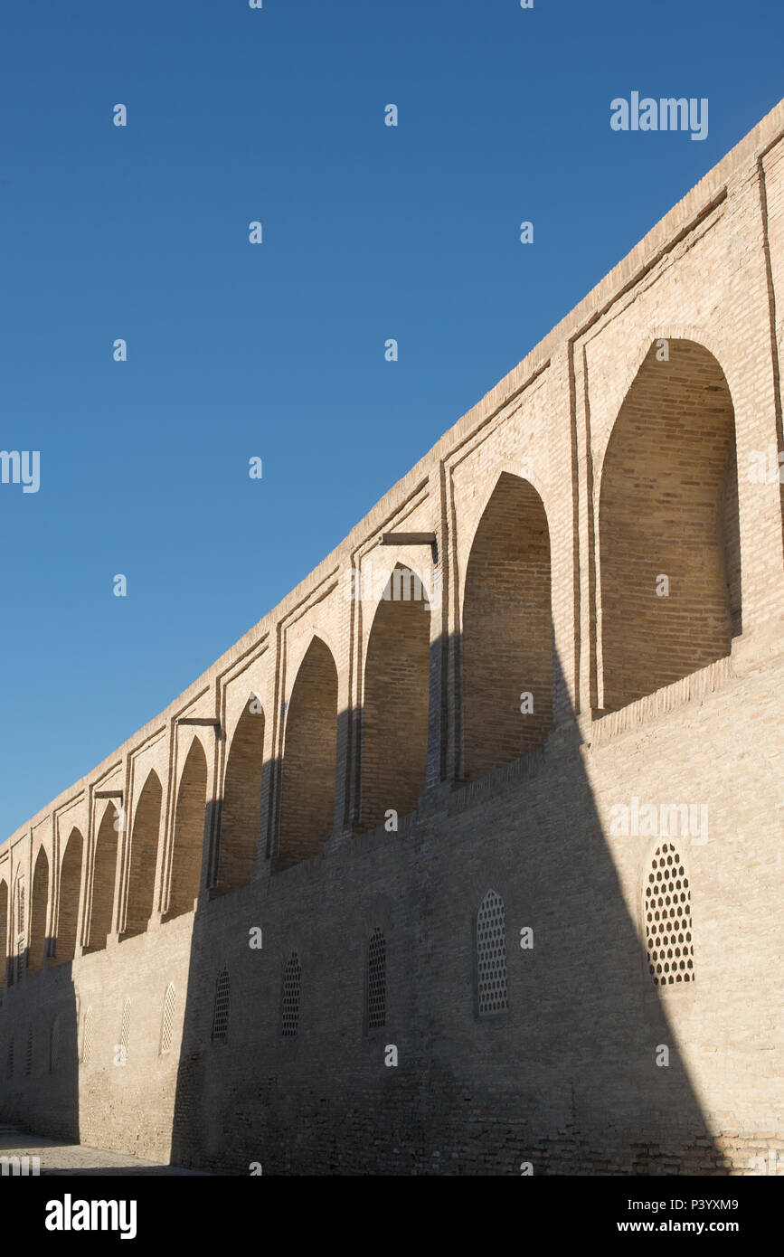 The old building, the wall with arches. Ancient buildings of medieval ...