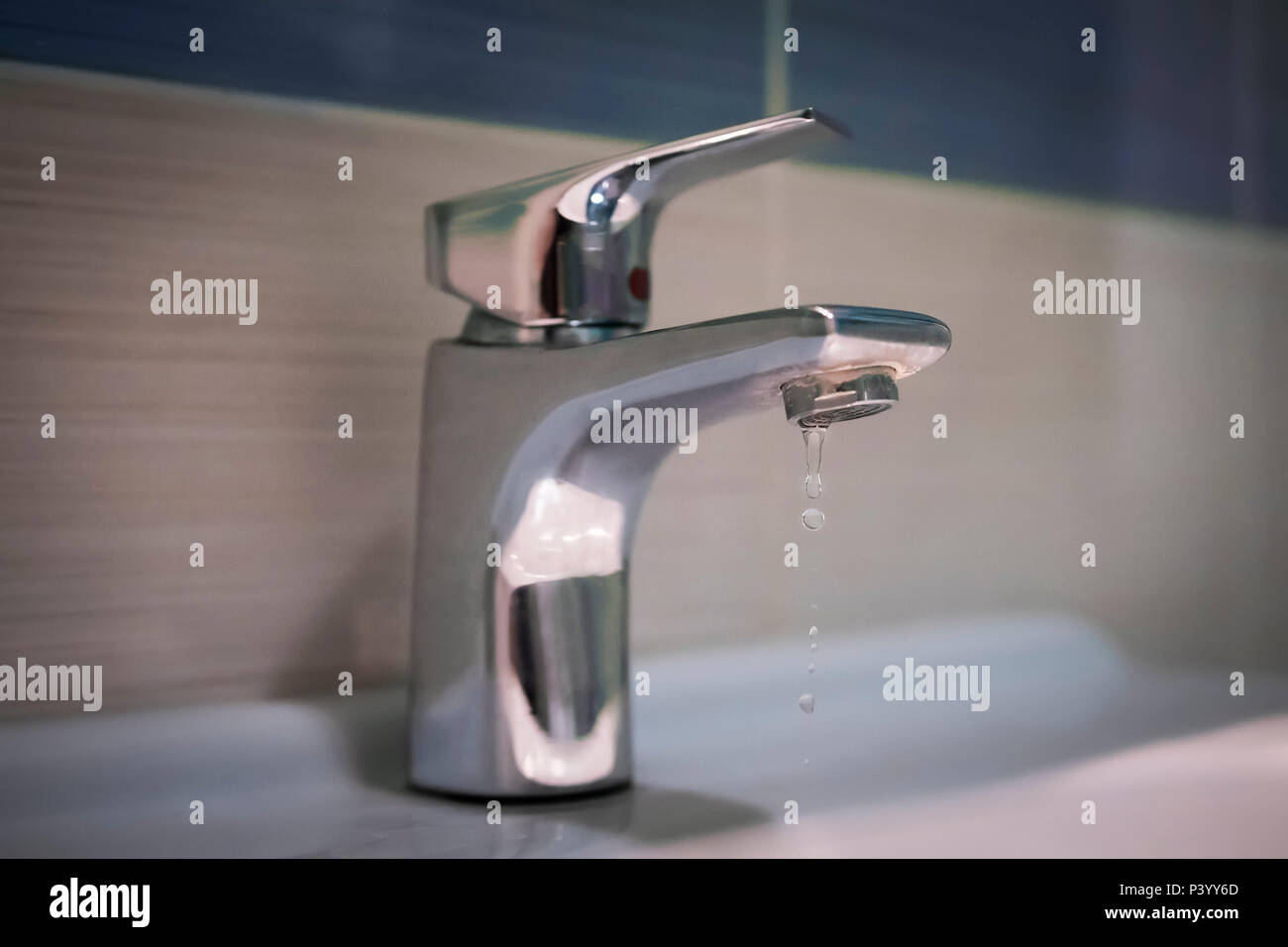 Water drop falling from tap hi-res stock photography and images - Alamy