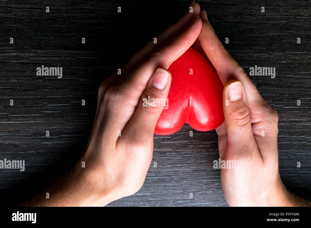 women hands, holding red heart, giving to someone. Love in hand Stock ...