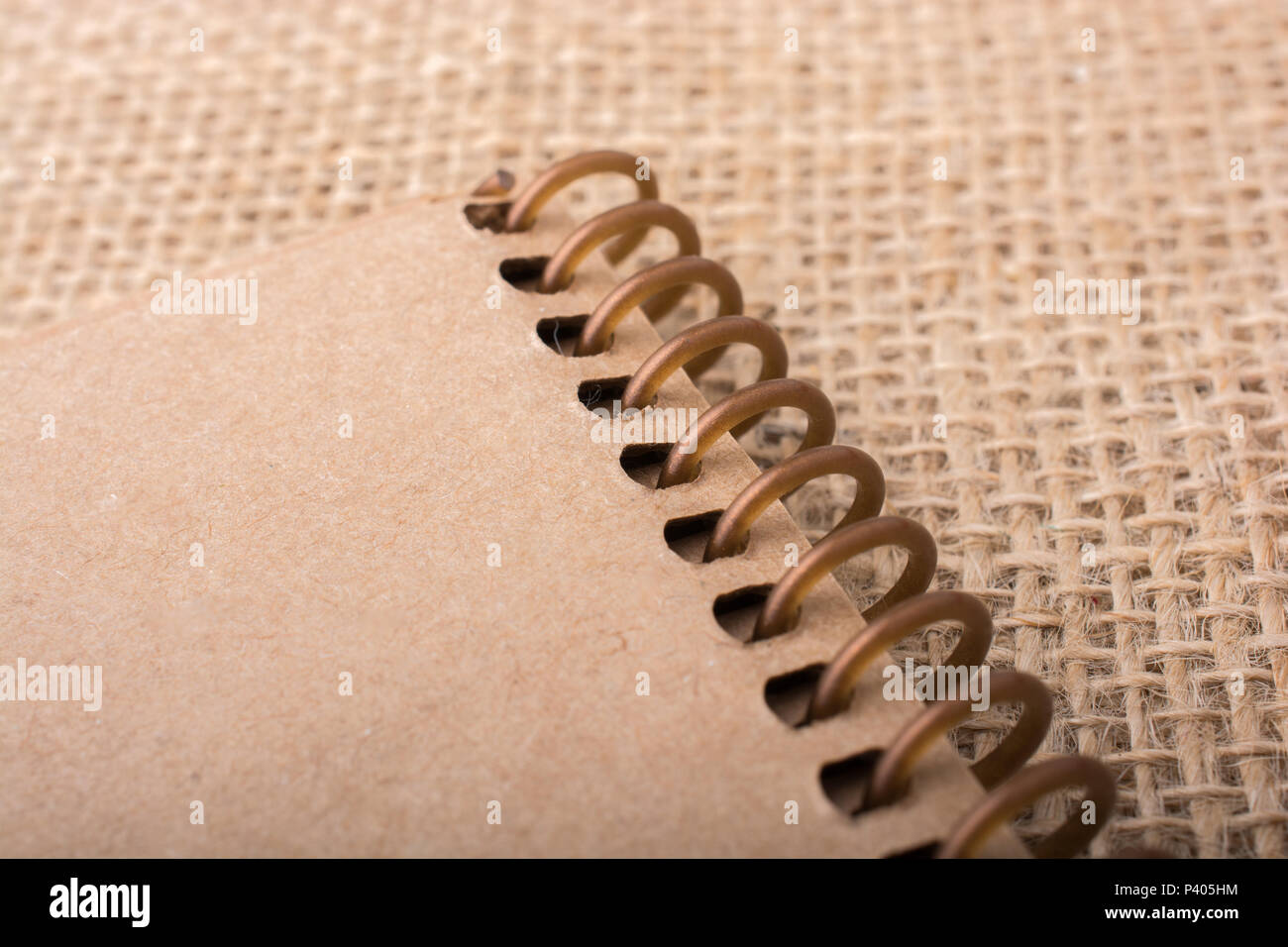 brown color notebook placed on a canvas background Stock Photo - Alamy