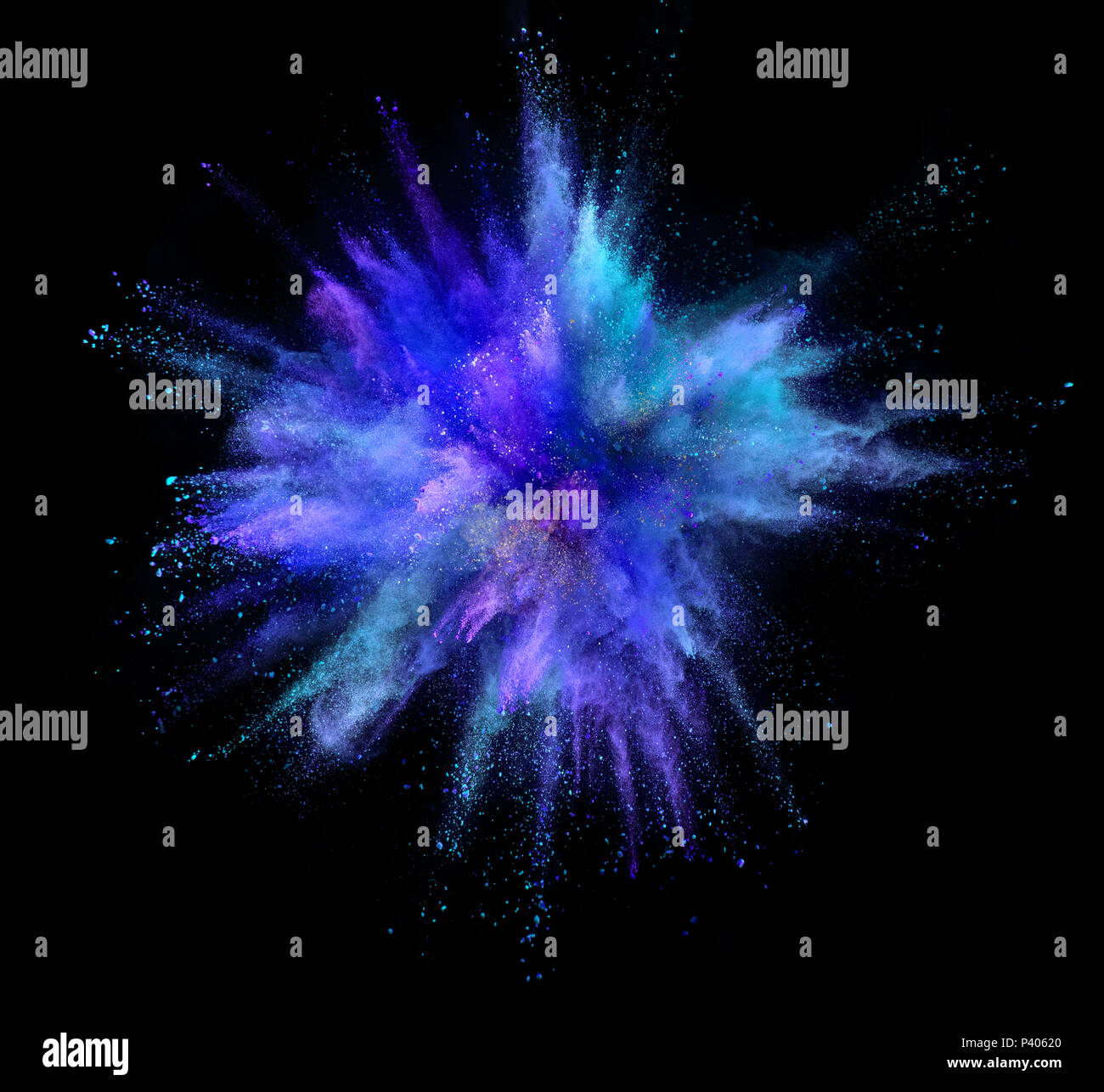 Explosion of coloured powder isolated on black background. Freeze ...