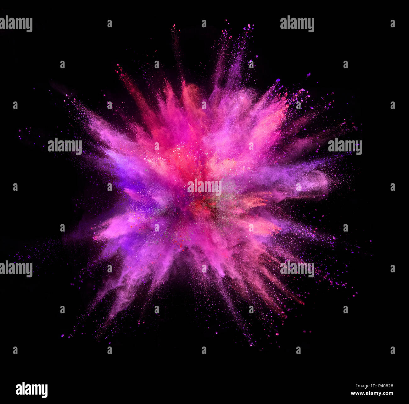 Explosion of coloured powder isolated on black background. Freeze ...